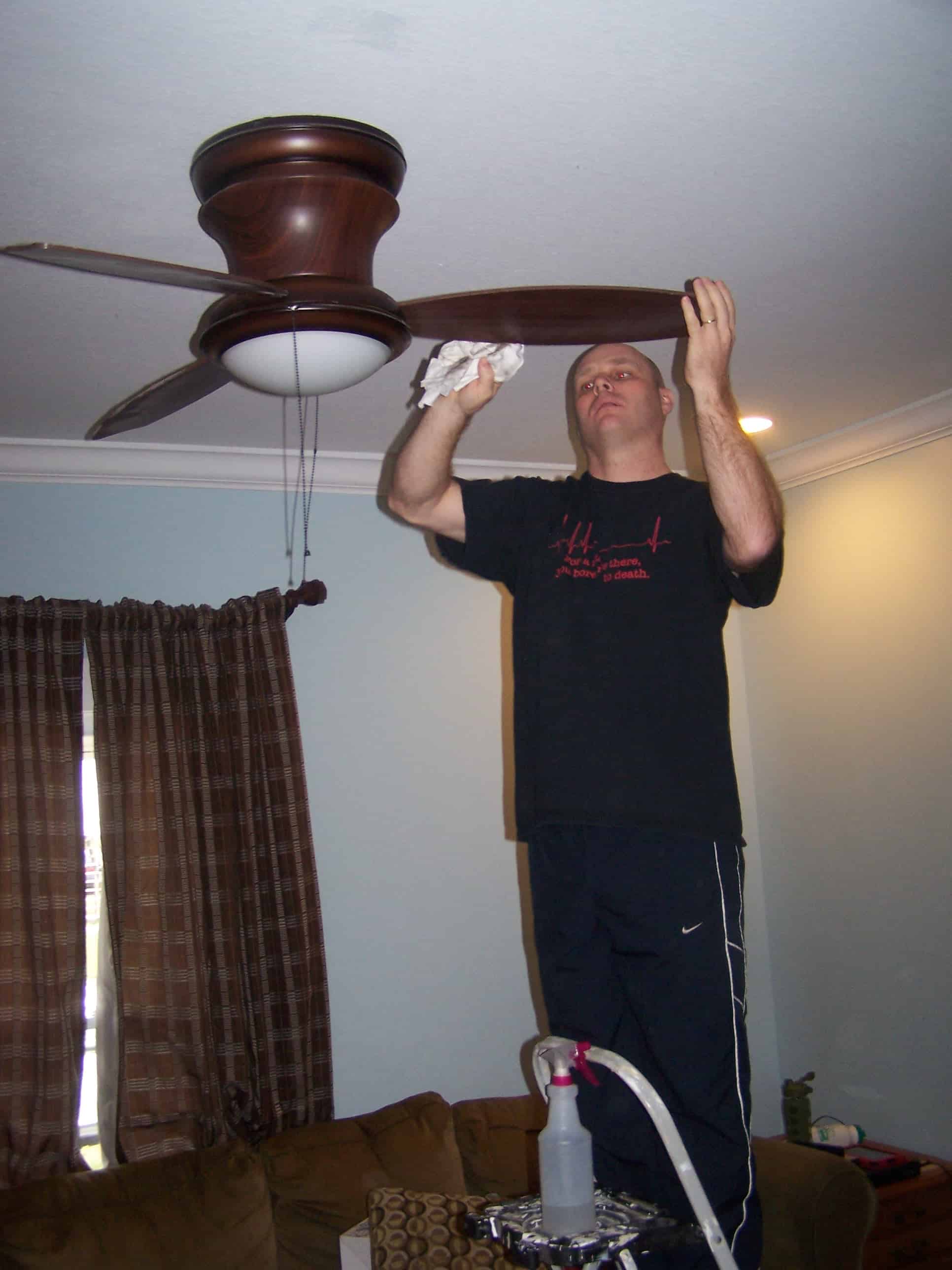 Husband-cleaning-family-room - Snail Pace Transformations